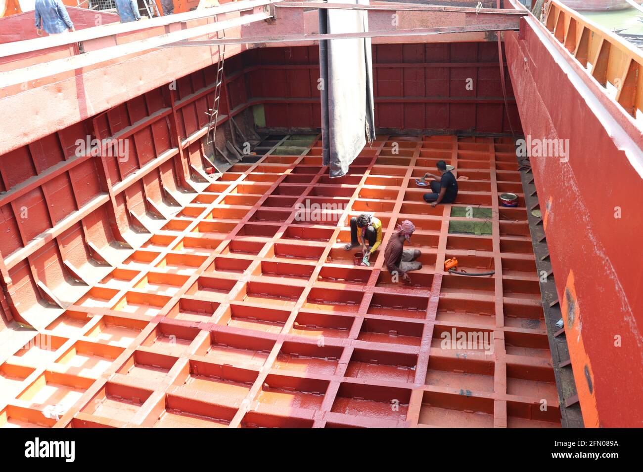 a boat restoration worker with machine and equipment Stock Photo - Alamy