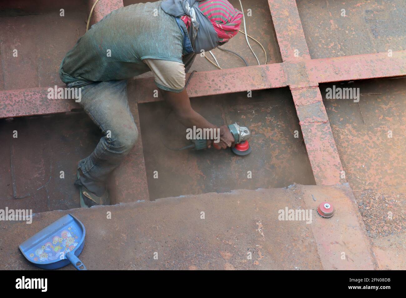 a boat restoration worker with machine and equipment Stock Photo - Alamy