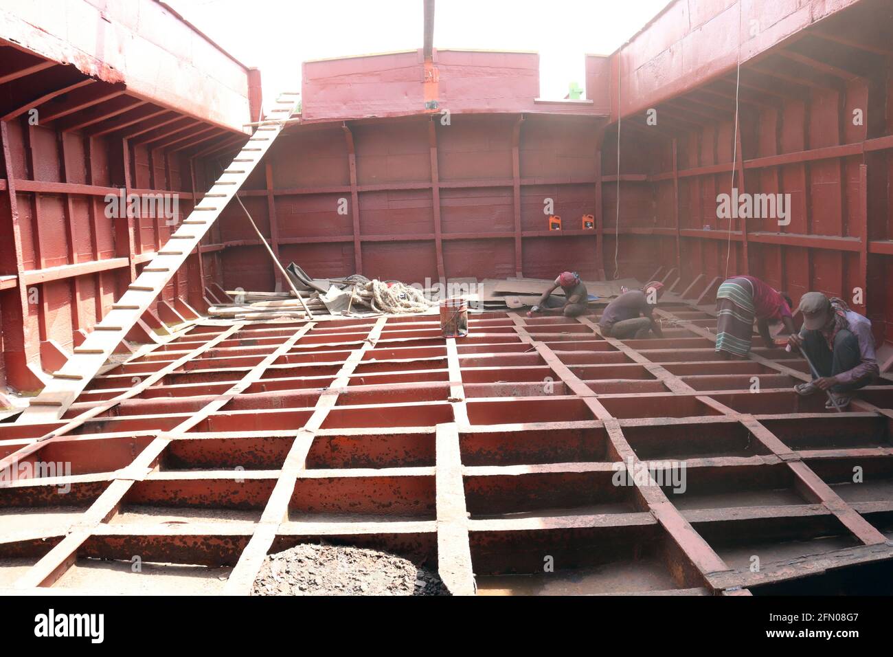 a boat restoration worker with machine and equipment Stock Photo - Alamy