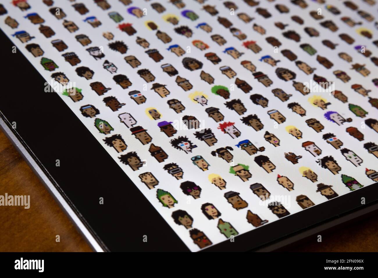 CryptoPunks NFT characters seen on the screen of tablet. One of the ...