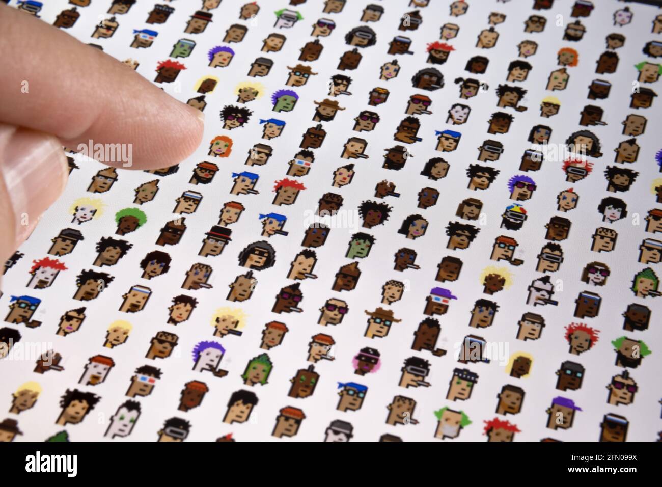 CryptoPunks NFT characters seen on the screen of tablet. One of the ...