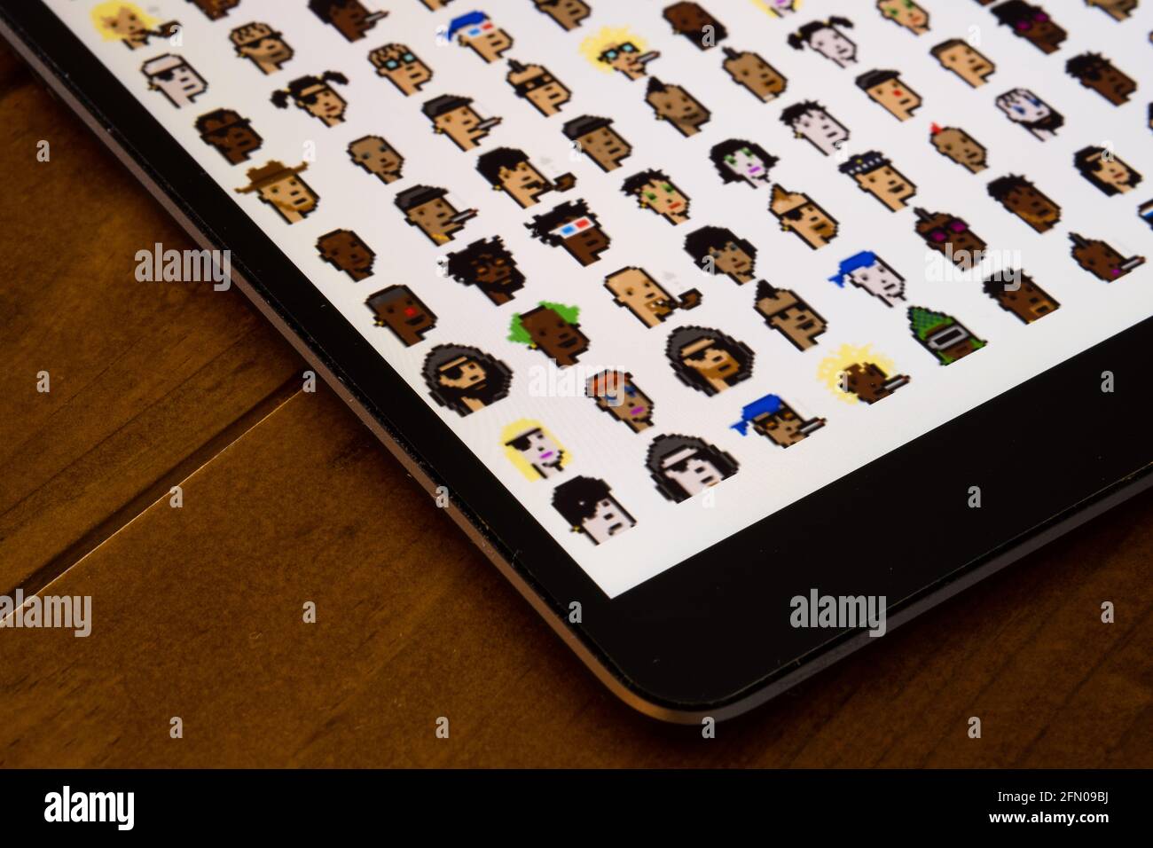 CryptoPunks NFT characters seen on the screen of tablet. One of the ...