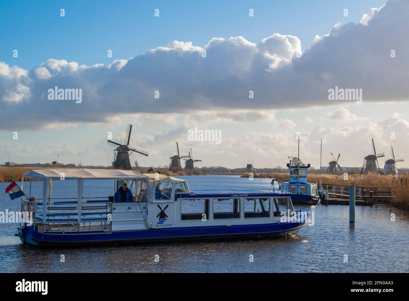 A cruise ship trip through the water channel to view the Overwaard Mill ...