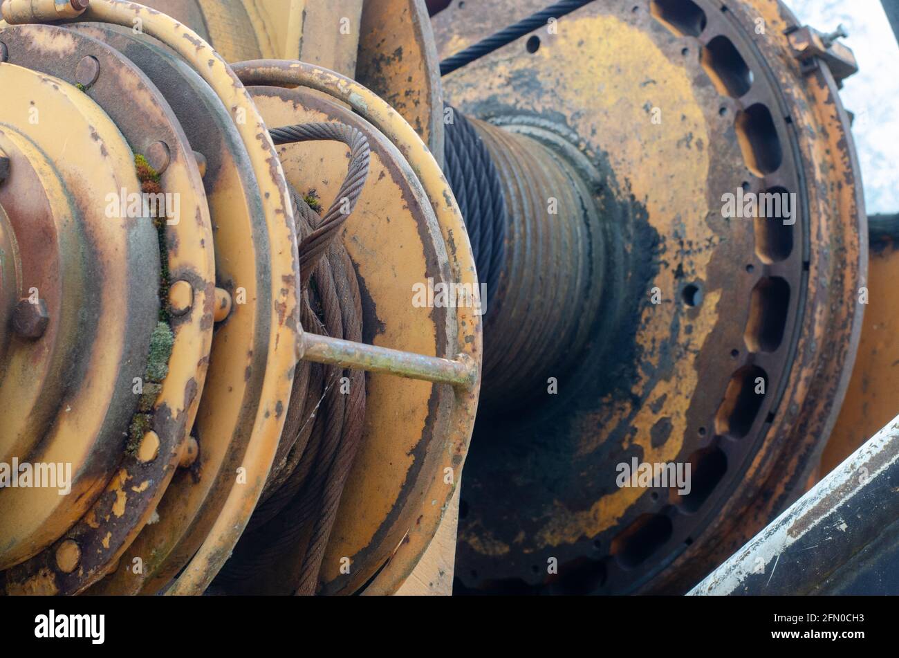 Closeup shot of a metal giant gold mining abandoned yellow pulley ...