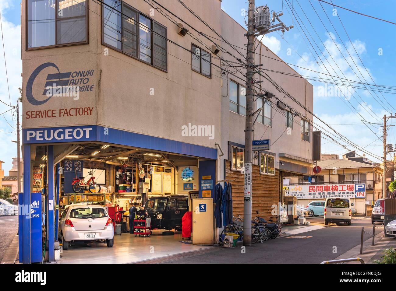tokyo, japan - may 05 2021: French cars Peugeot Service factory garage ...