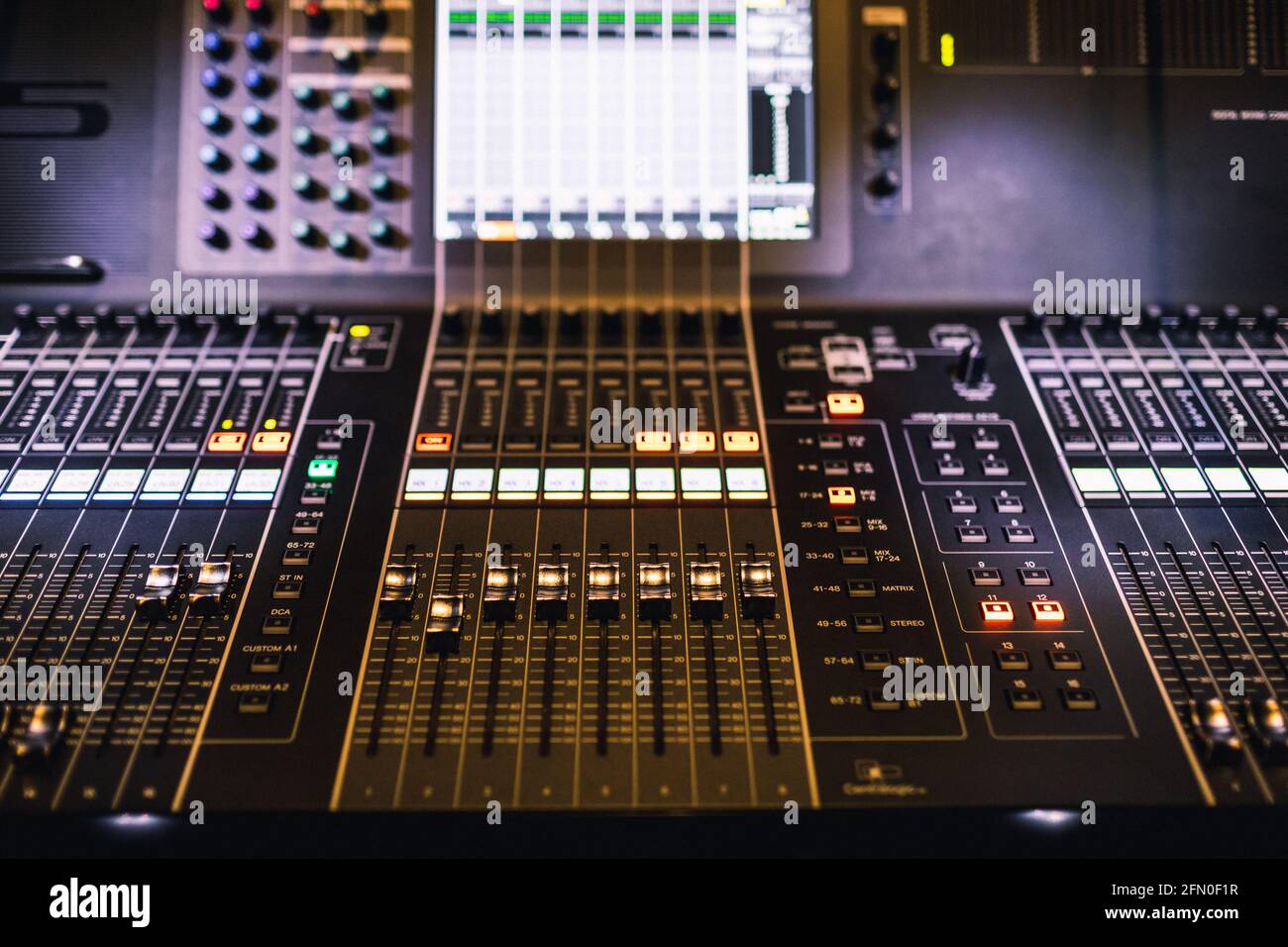 Professional sound and audio mixer control panel with buttons and ...