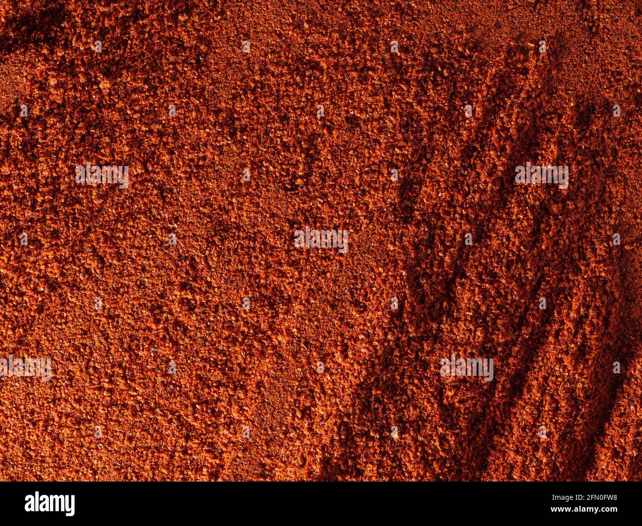 Red ground paprika, with different surface texture, food background ...