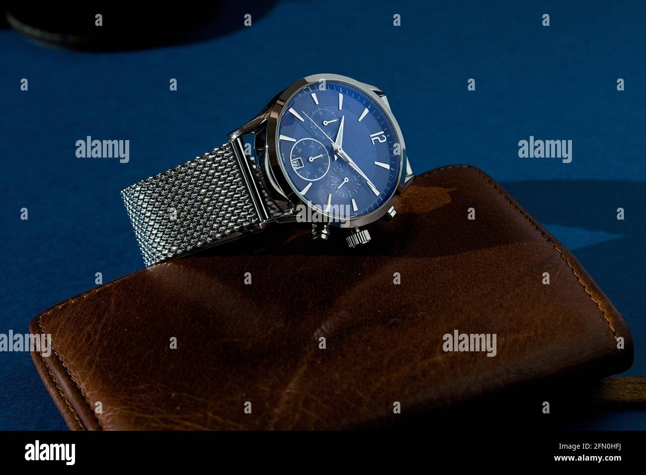 luxury fashion watch with blue dial and metal bracelet Stock Photo - Alamy