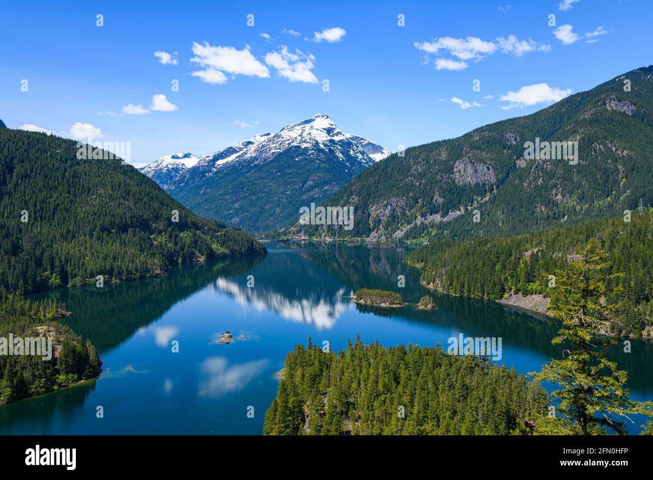 Diablo Lake in the North Cascades of Washington State under a blue sky ...