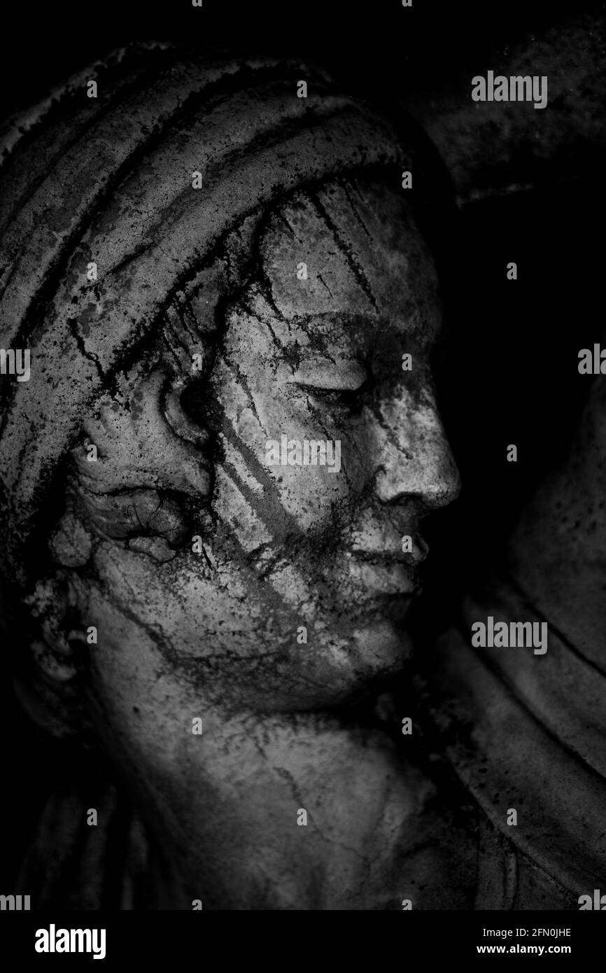 Statue of woman's excoriated stone face in North Yorkshire, England ...