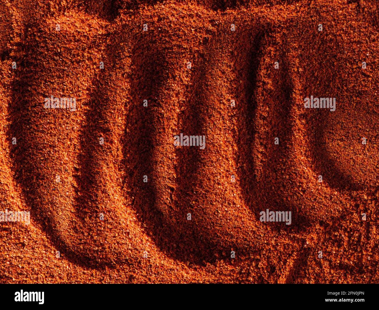 Red ground paprika, with different surface texture, food background ...