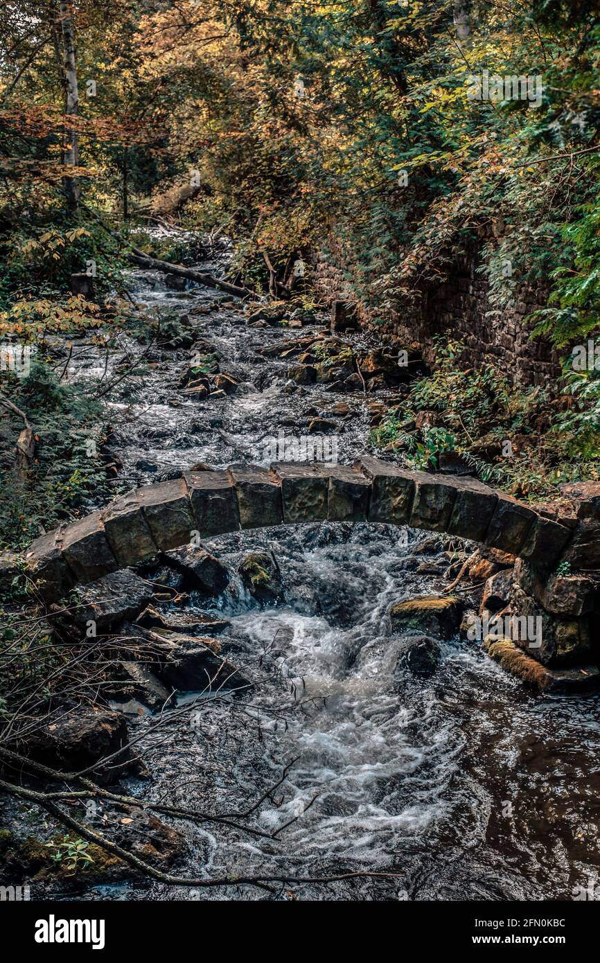 Stone bridge over rushing water hi-res stock photography and images - Alamy