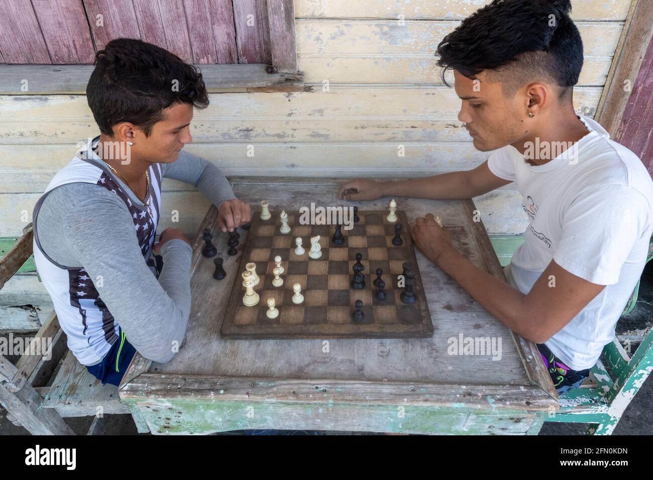Cuban young men playing chess, rural scene, Cuba Stock Photo - Alamy