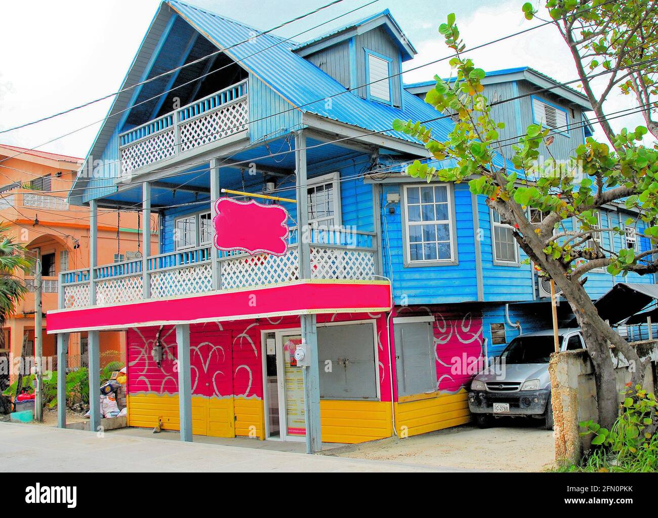 A very colorful building with main floor restaurant; stands in ...