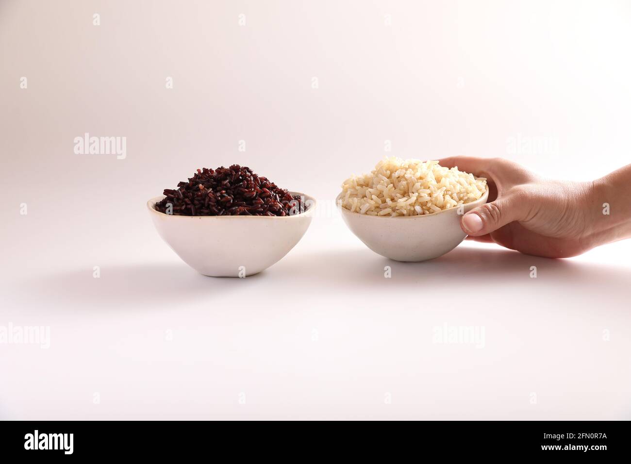 Organic boiled brown rice on bowl isolated in white background Stock ...