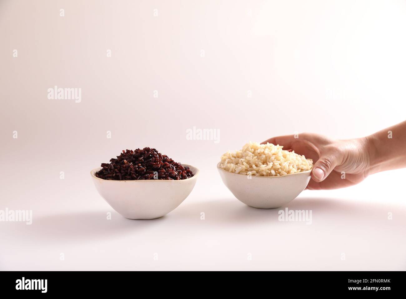 Organic boiled brown rice on bowl isolated in white background Stock ...