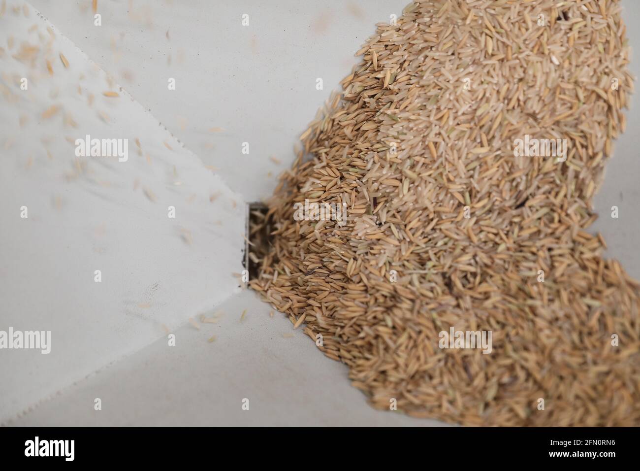 Factory machine Milling rice in close up Stock Photo - Alamy