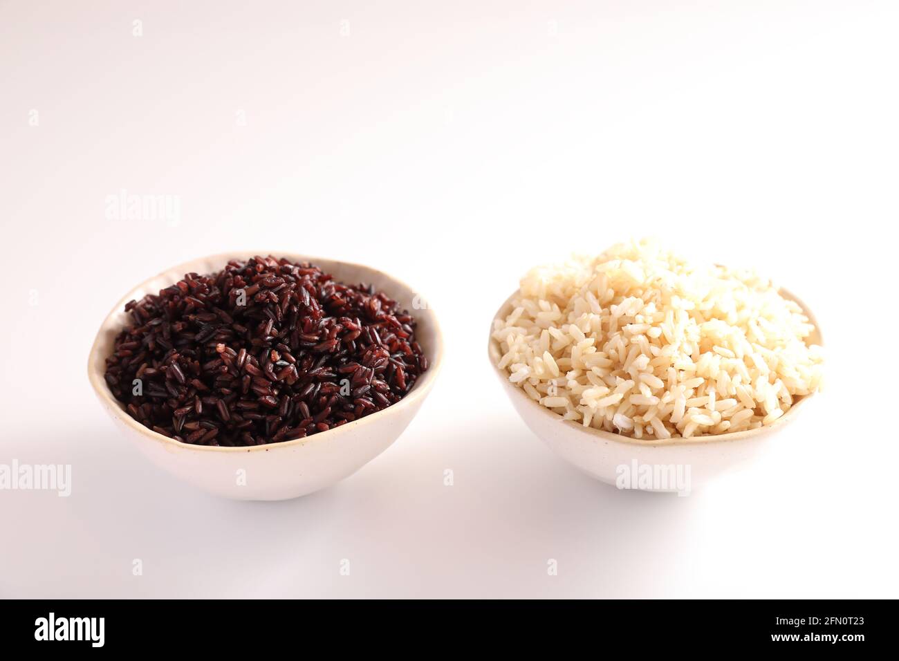 Organic boiled brown rice on bowl isolated in white background Stock ...