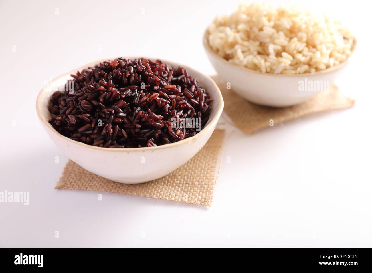 Organic boiled brown rice on bowl isolated in white background Stock ...