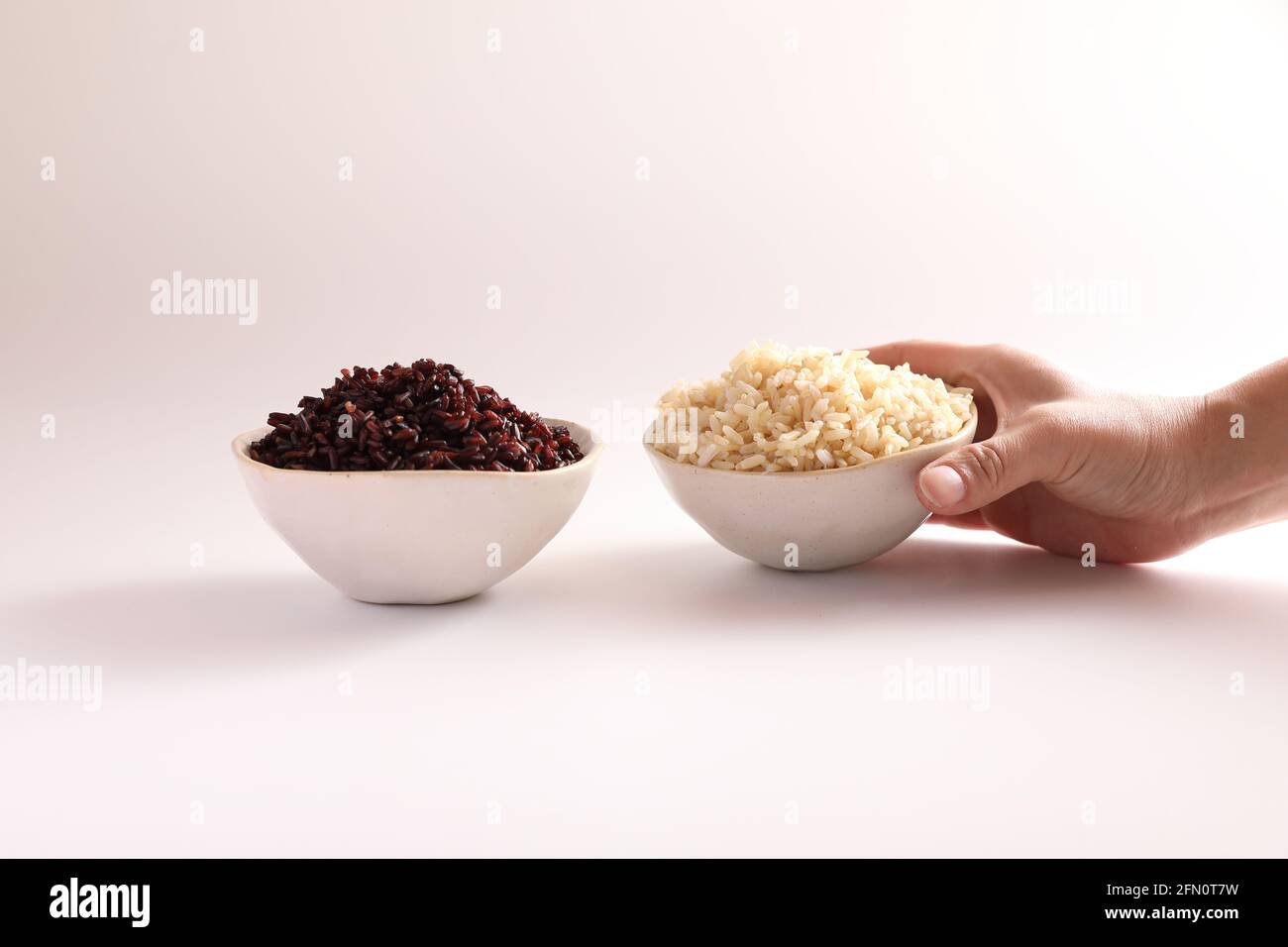 Organic boiled brown rice on bowl isolated in white background Stock ...
