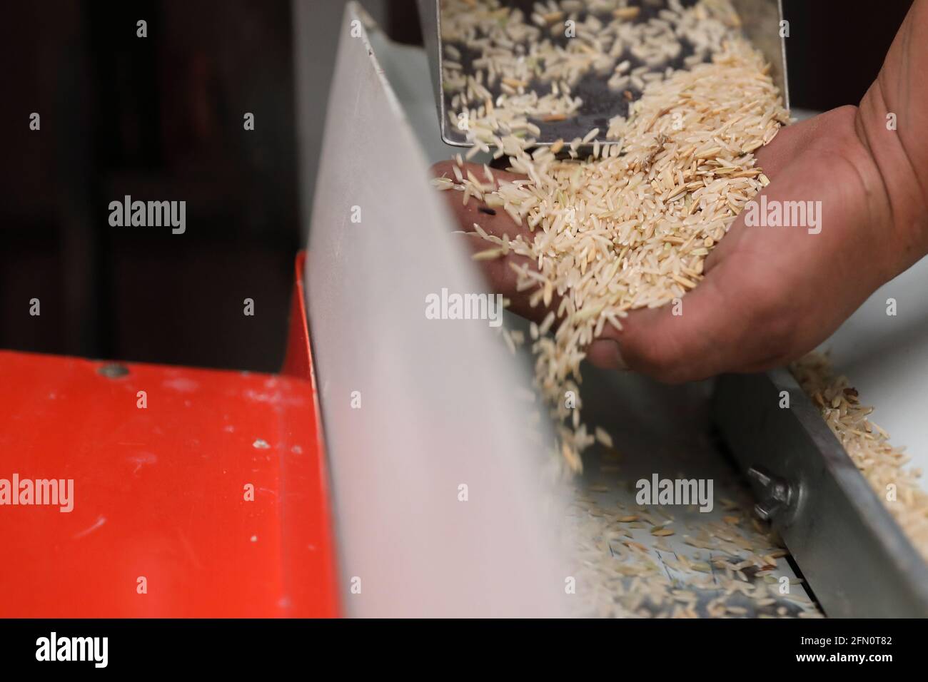Factory machine Milling rice in close up Stock Photo - Alamy