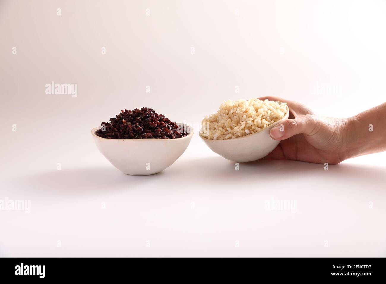 Organic boiled brown rice on bowl isolated in white background Stock ...