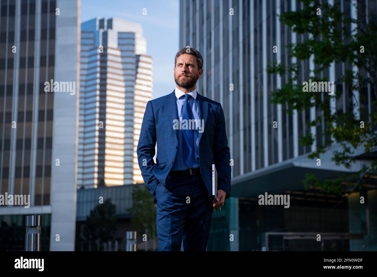 Businessman with success business. Outdoors portrait male model in suit ...