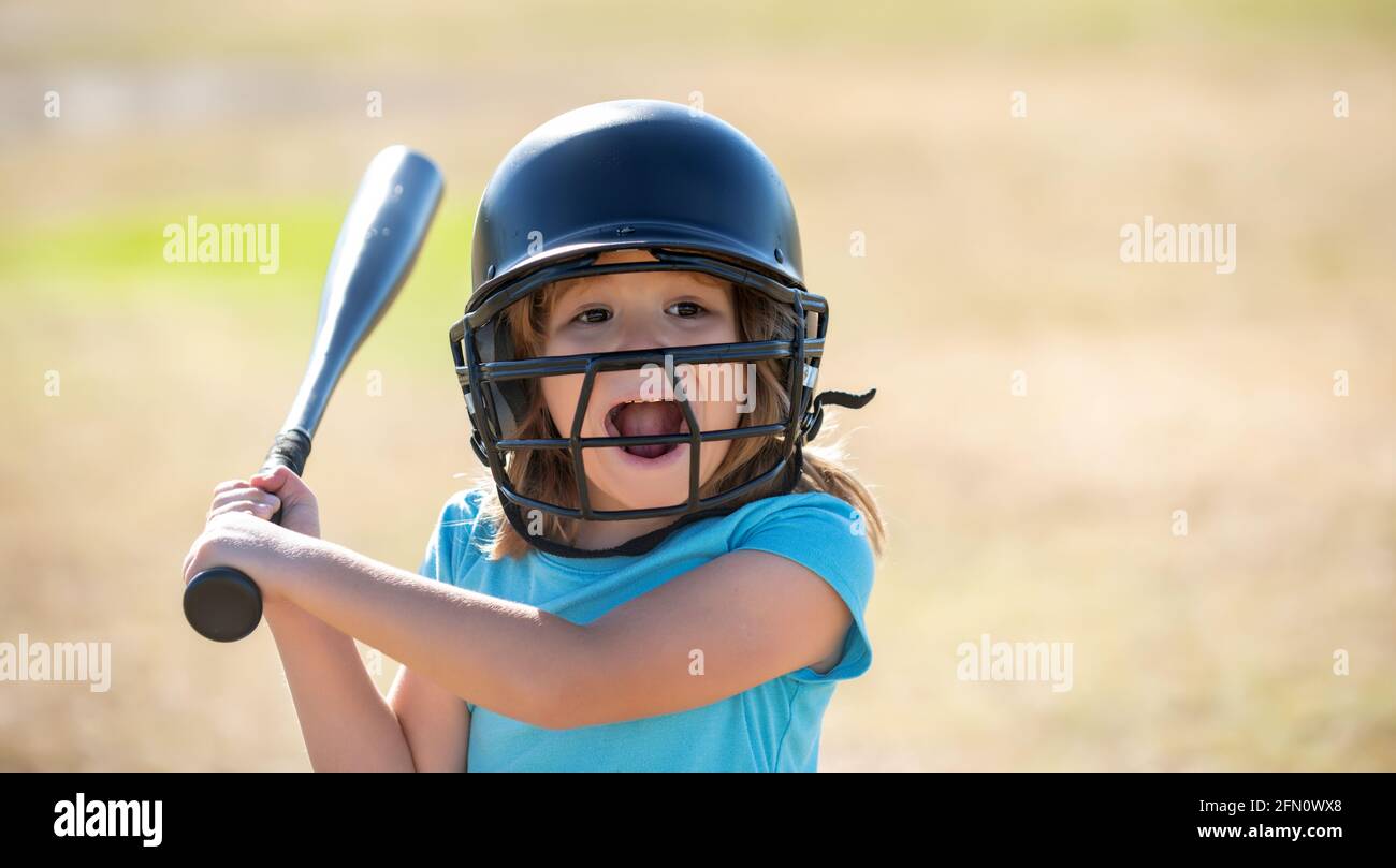 Kid baseball ready to bat. Child batter about to hit a pitch during a ...