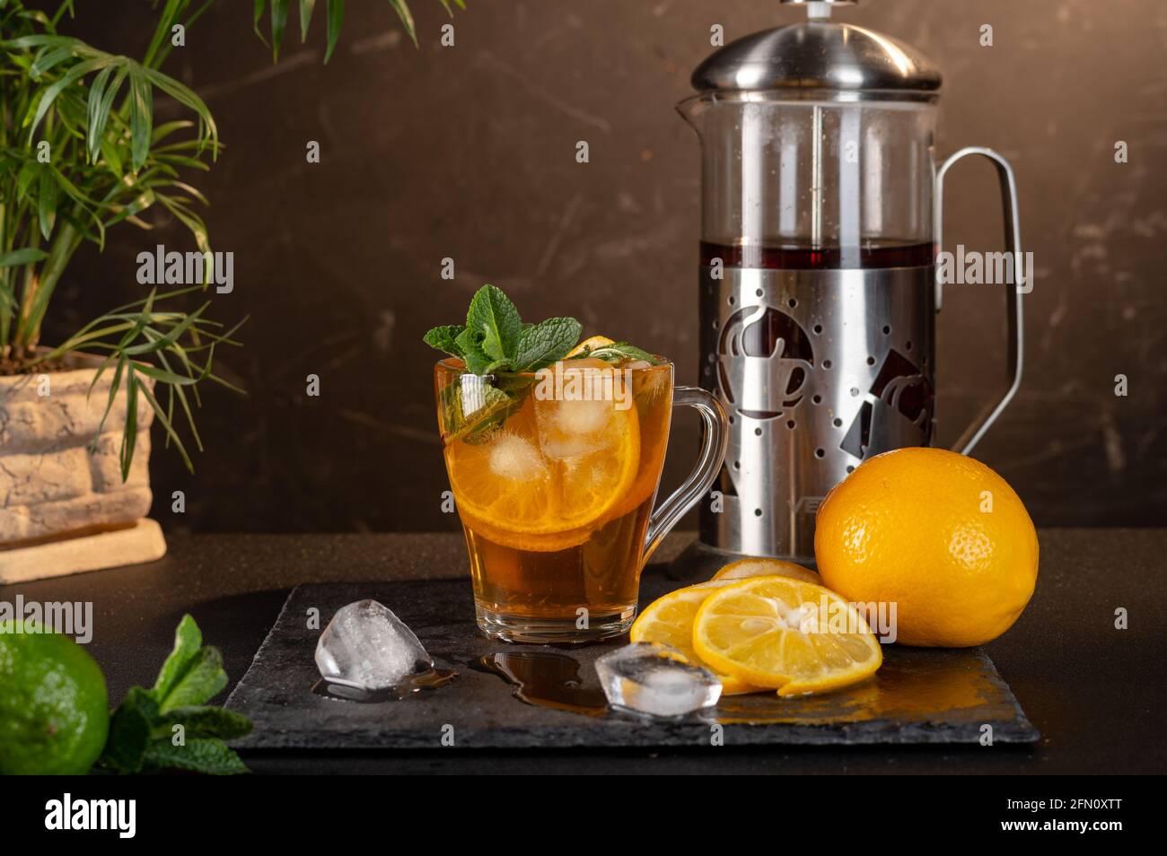 Iced tea with lemon and mint. Cool iced tea. Thirst quenching tea ...