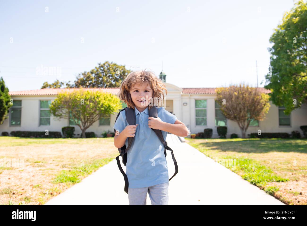 Elementary school kid running at school. Kids education concept Stock ...