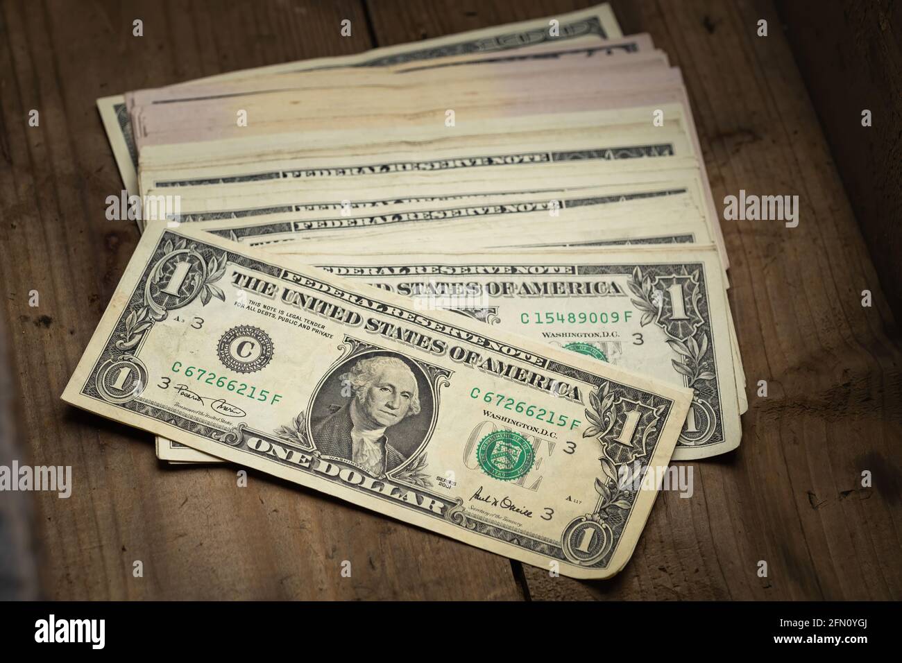 A money pile of one US banknotes with president Washington portrait ...