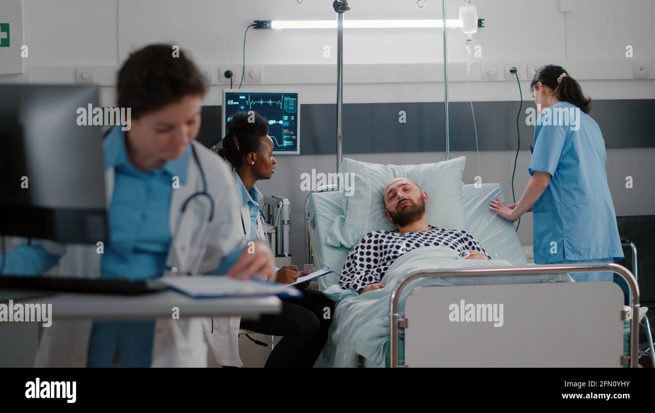 Medical practitioner doctors checking sick man analyzing disease ...