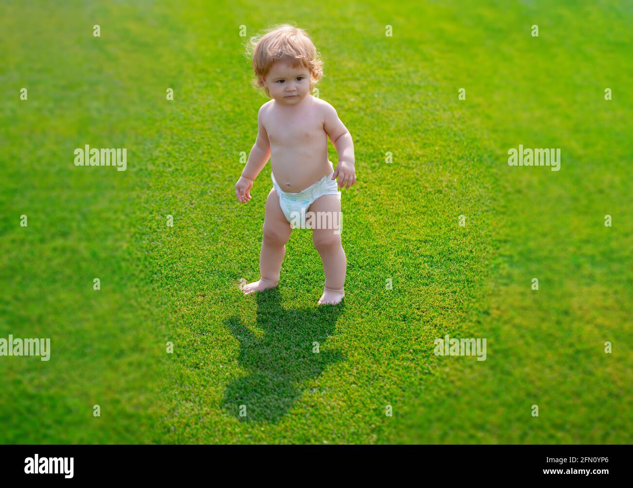 Warm spring child wearing a diaper in the park Stock Photo - Alamy