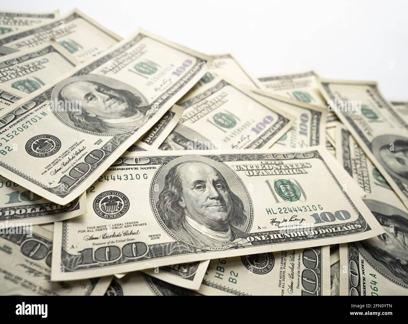 A money pile of one hundred US banknotes with president Franklin ...