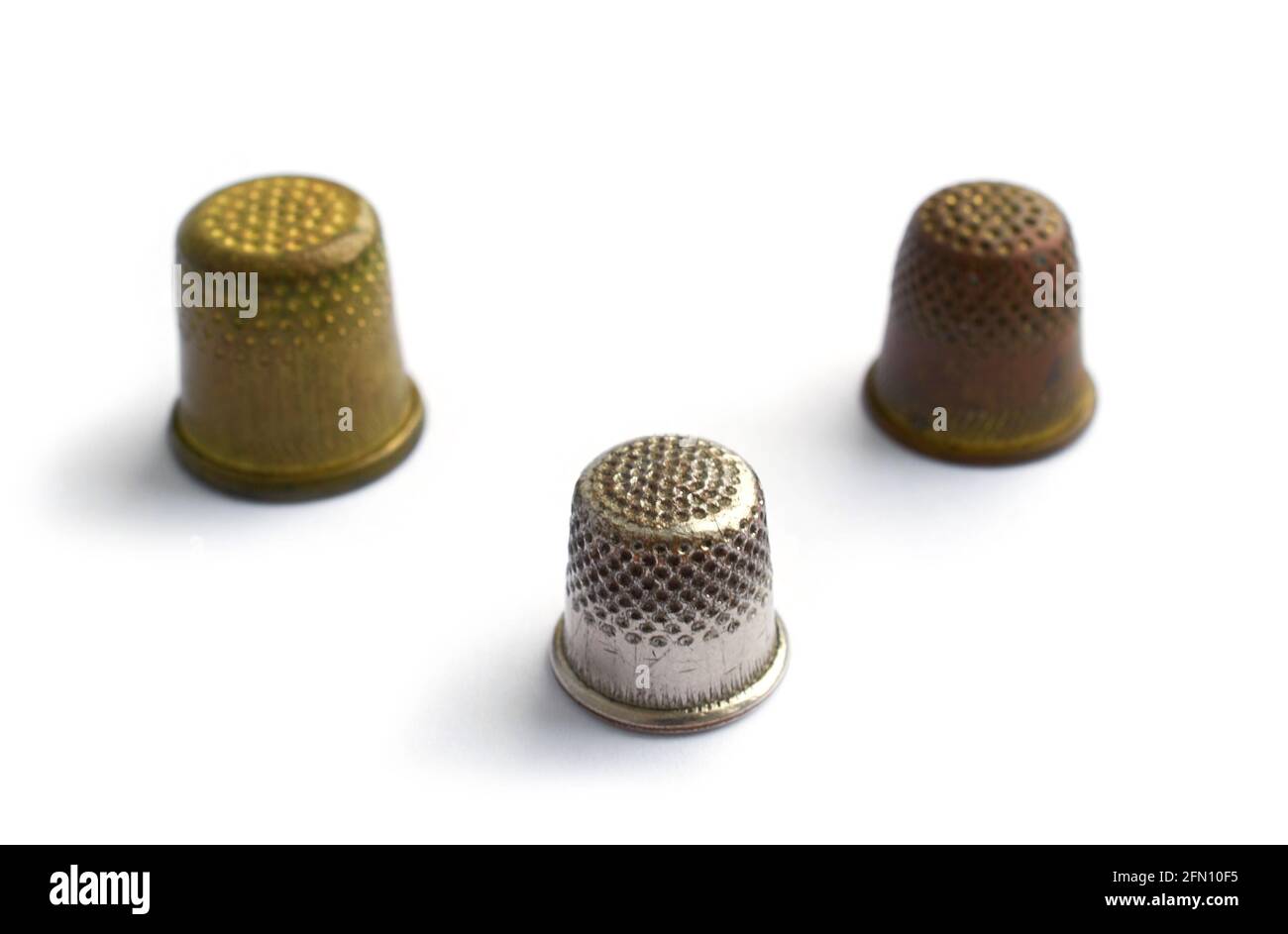 Three vintage thimbles isolated on a white background with shadow Stock ...