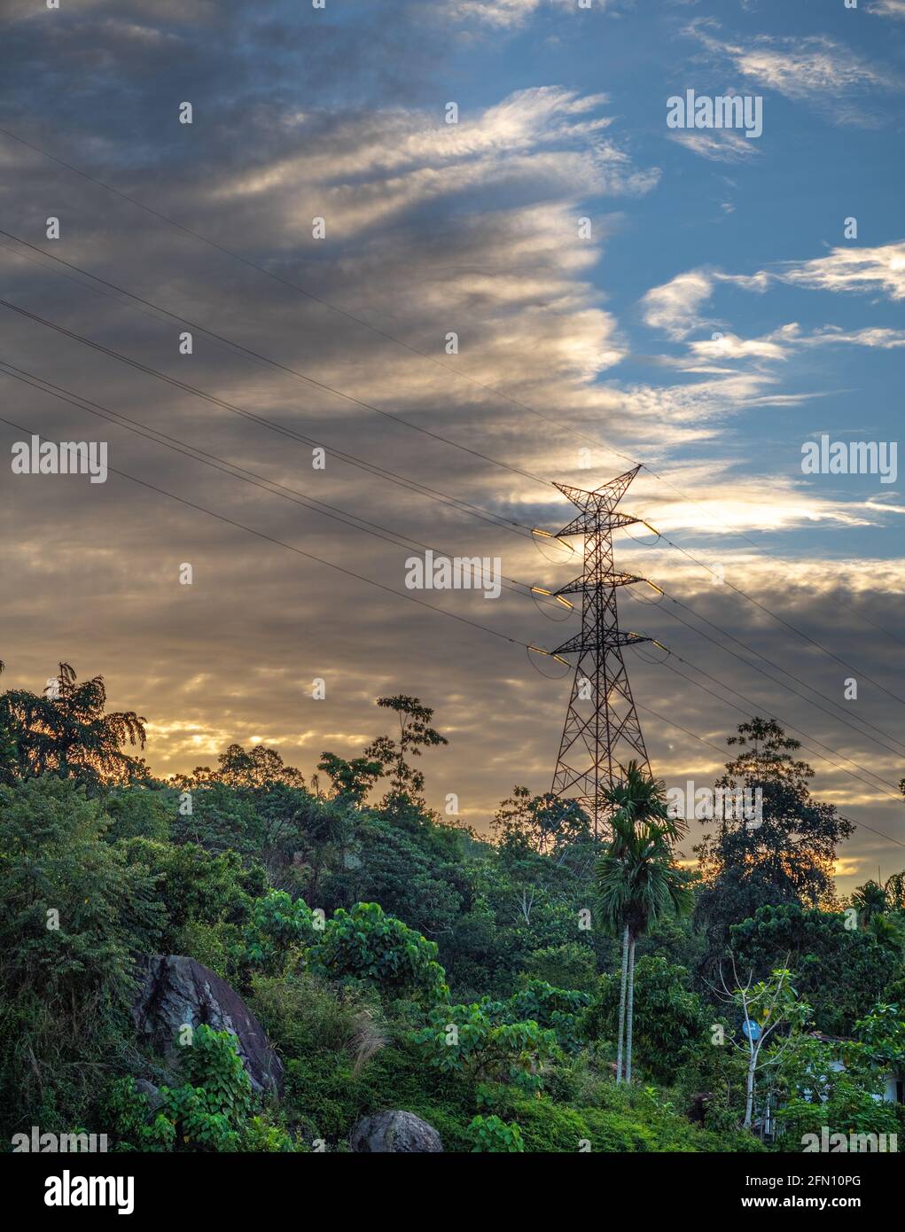 High voltage pylon standing tall early in the morning dramatic ...