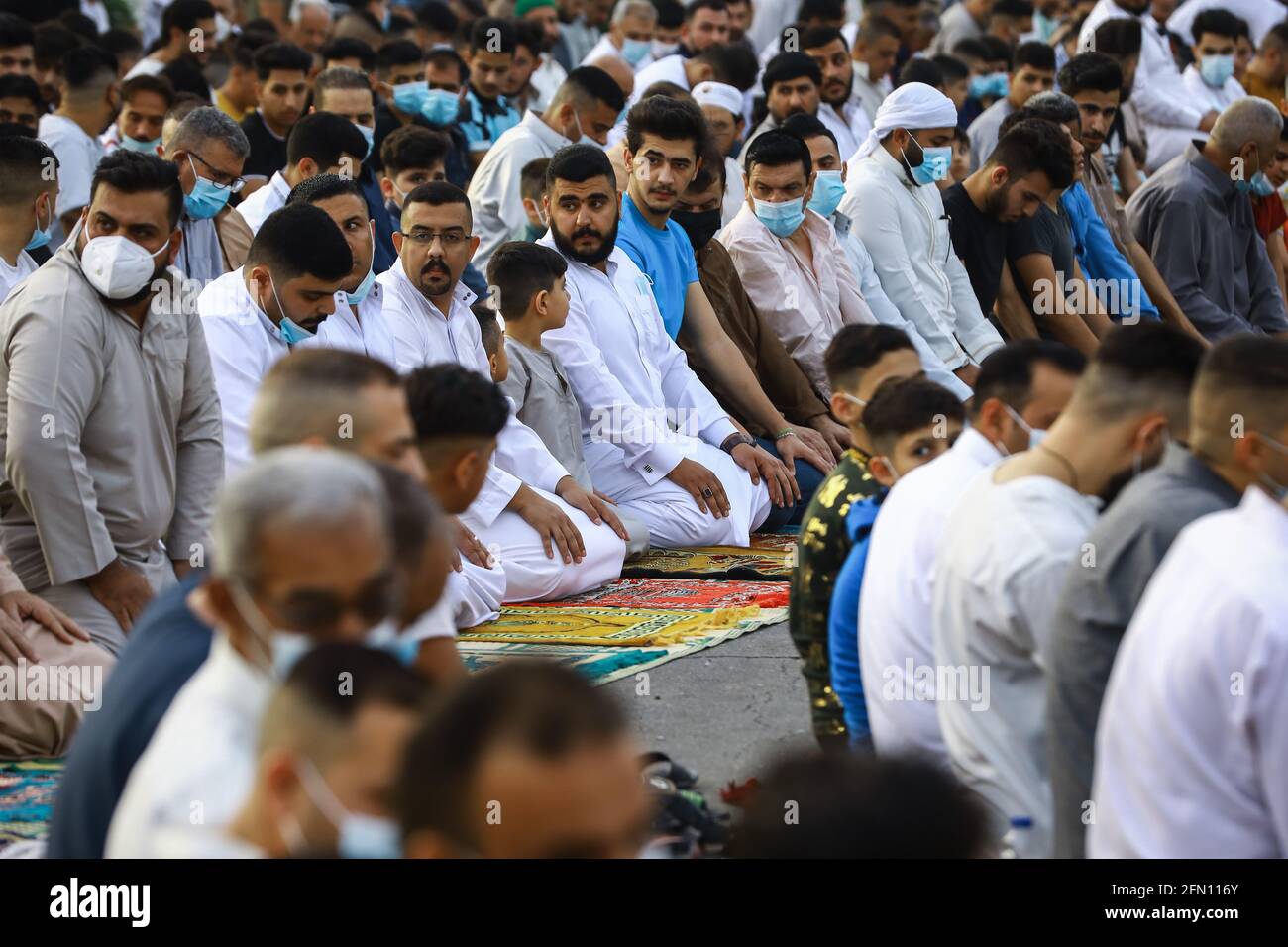 Baghdad, Iraq. 13th May, 2021. Worshippers perform Eid al-Fitr prayer ...