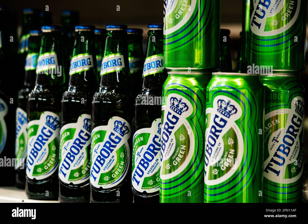 Cans and bottles of Tuborg beer on a shelf in a store Stock Photo - Alamy