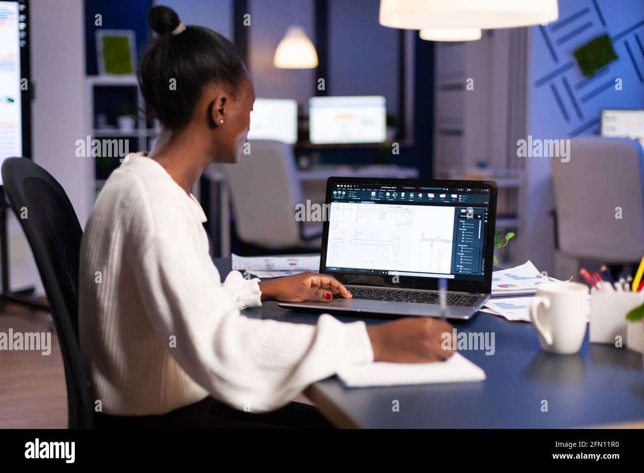 African engineer constructor designer architect analysing new bluilding ...