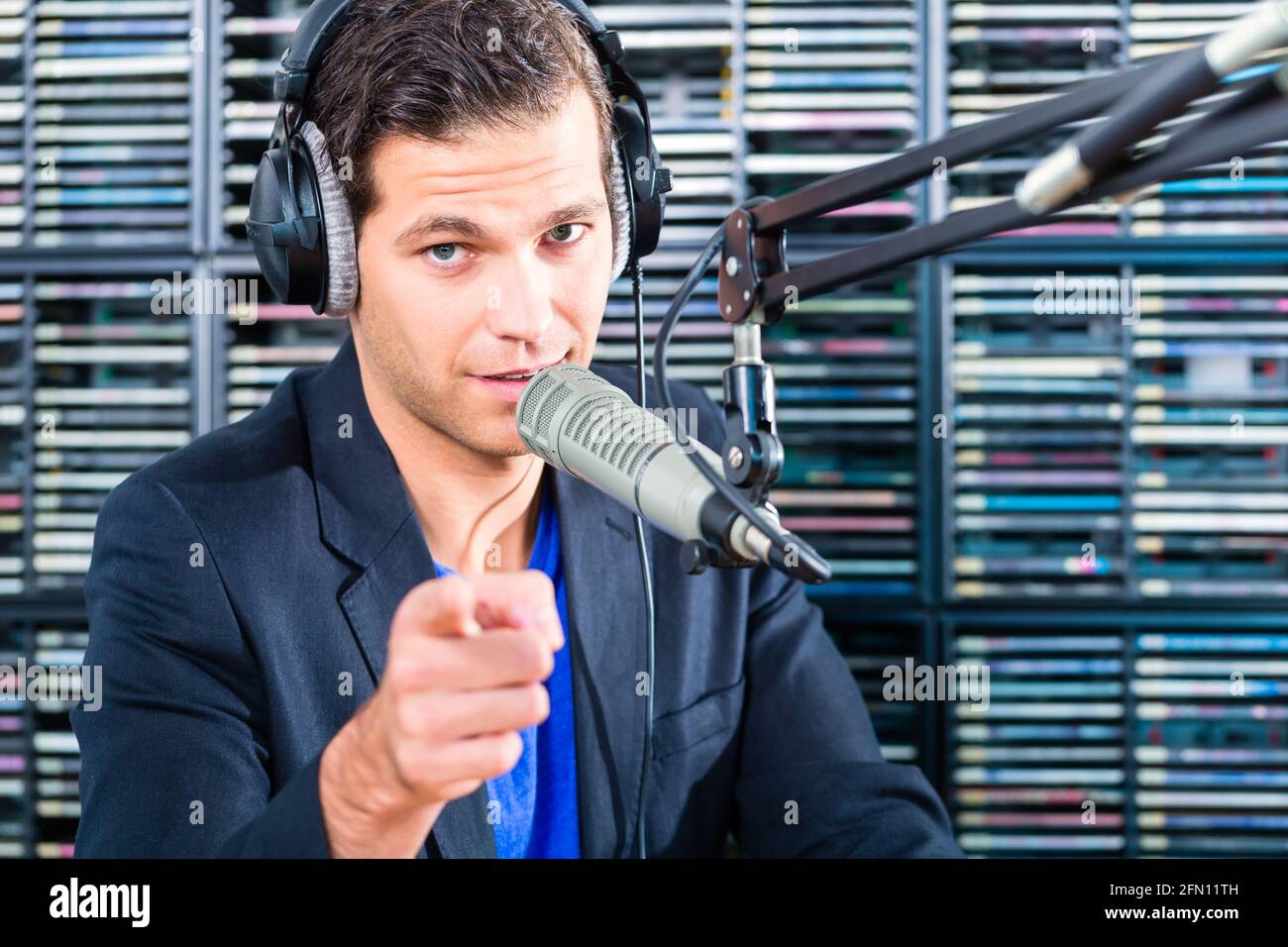 Male Presenter in radio station hosting show for radio live in Studio ...