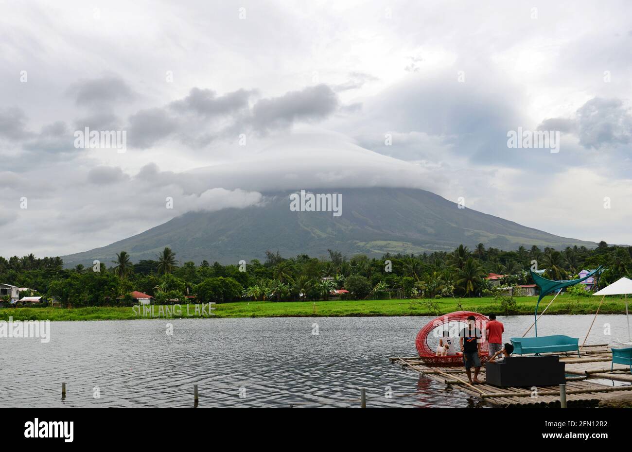 The Mayon volcano covered with a beautiful cloud Stock Photo - Alamy