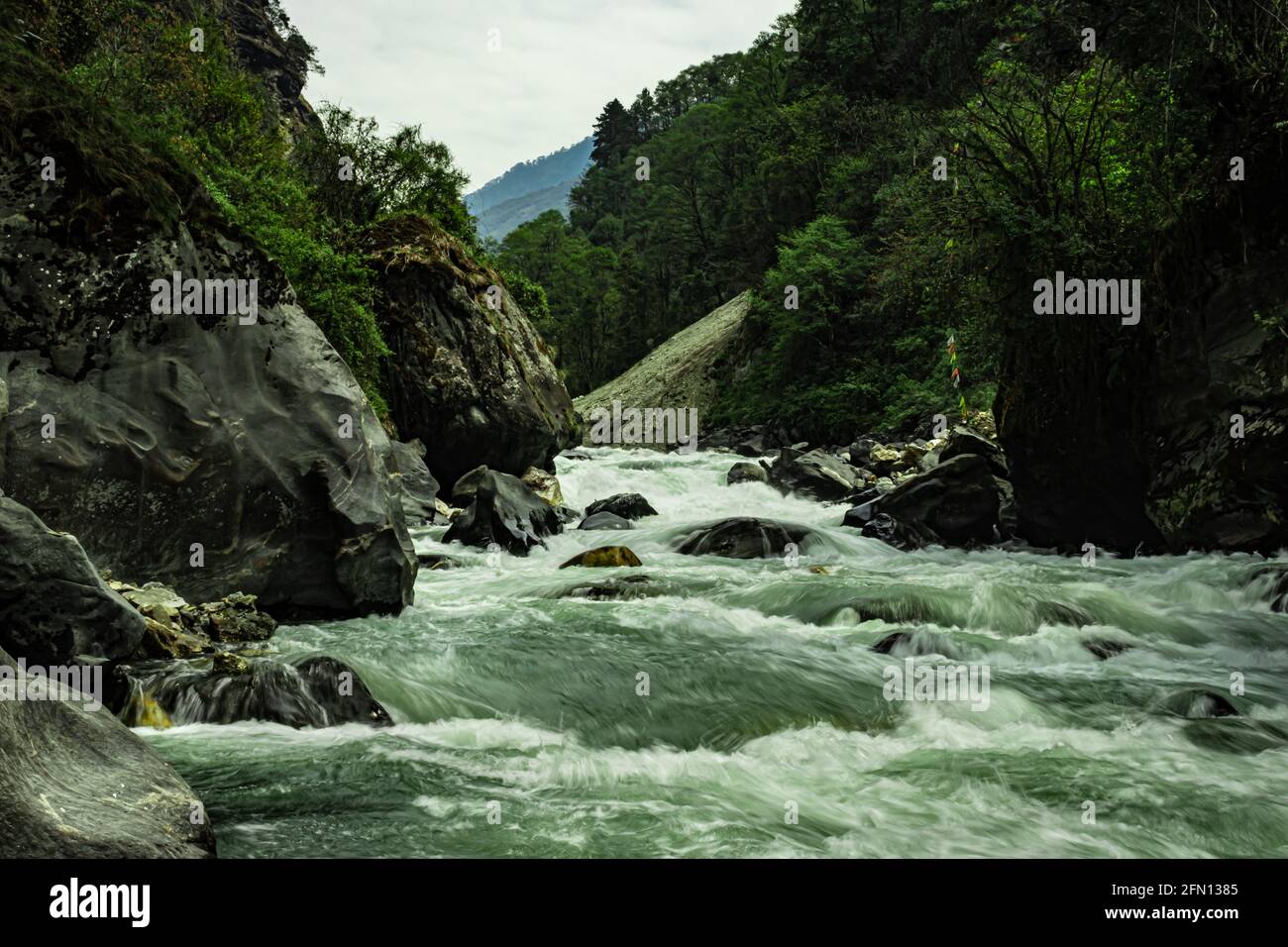 mountain river extreme water flow at day long exposure image is taken ...