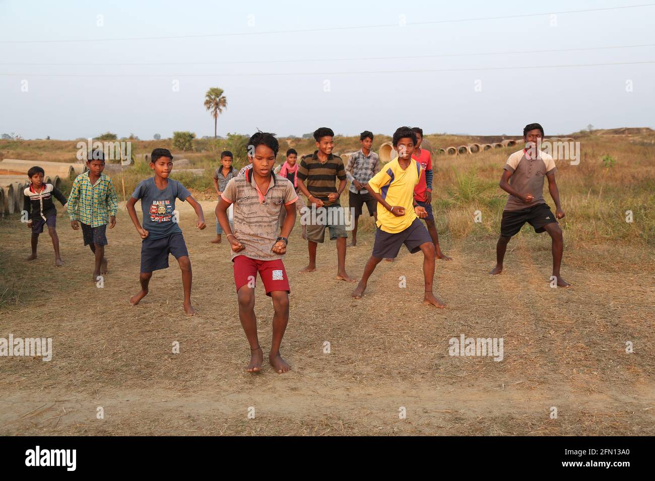 Children exercising to keep fit. BAIGA TRIBE, Chiyapadar Baiga village ...