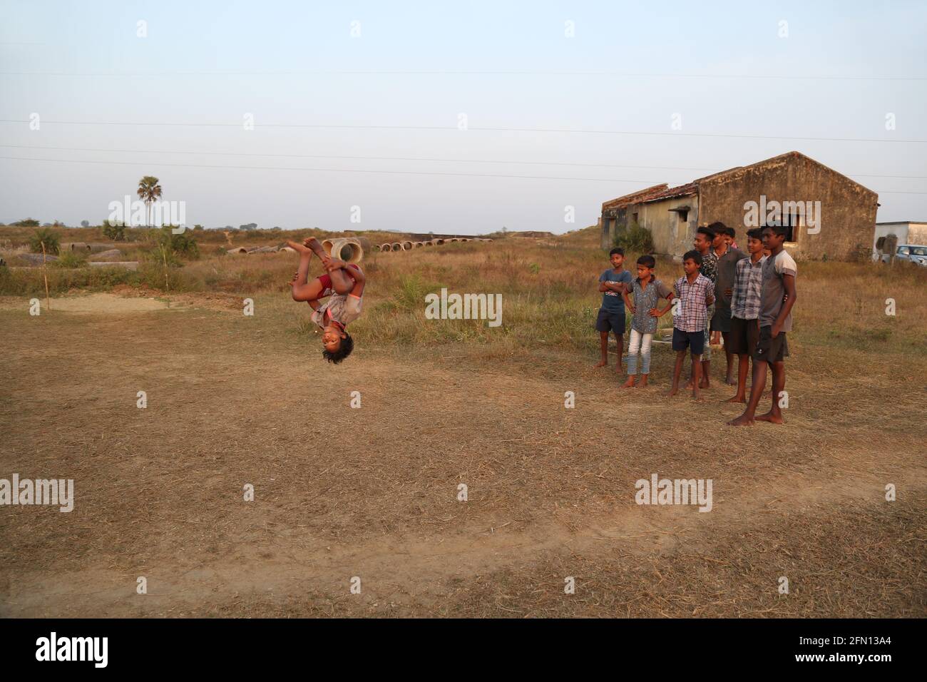 Children exercising to keep fit. BAIGA TRIBE, Chiyapadar Baiga village ...