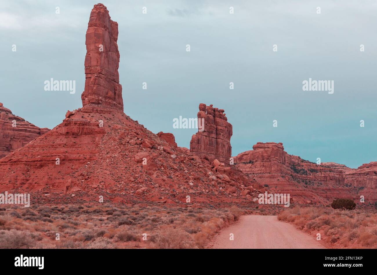 Valley of the Gods rock formation with Monument Valley at sunrise Stock ...