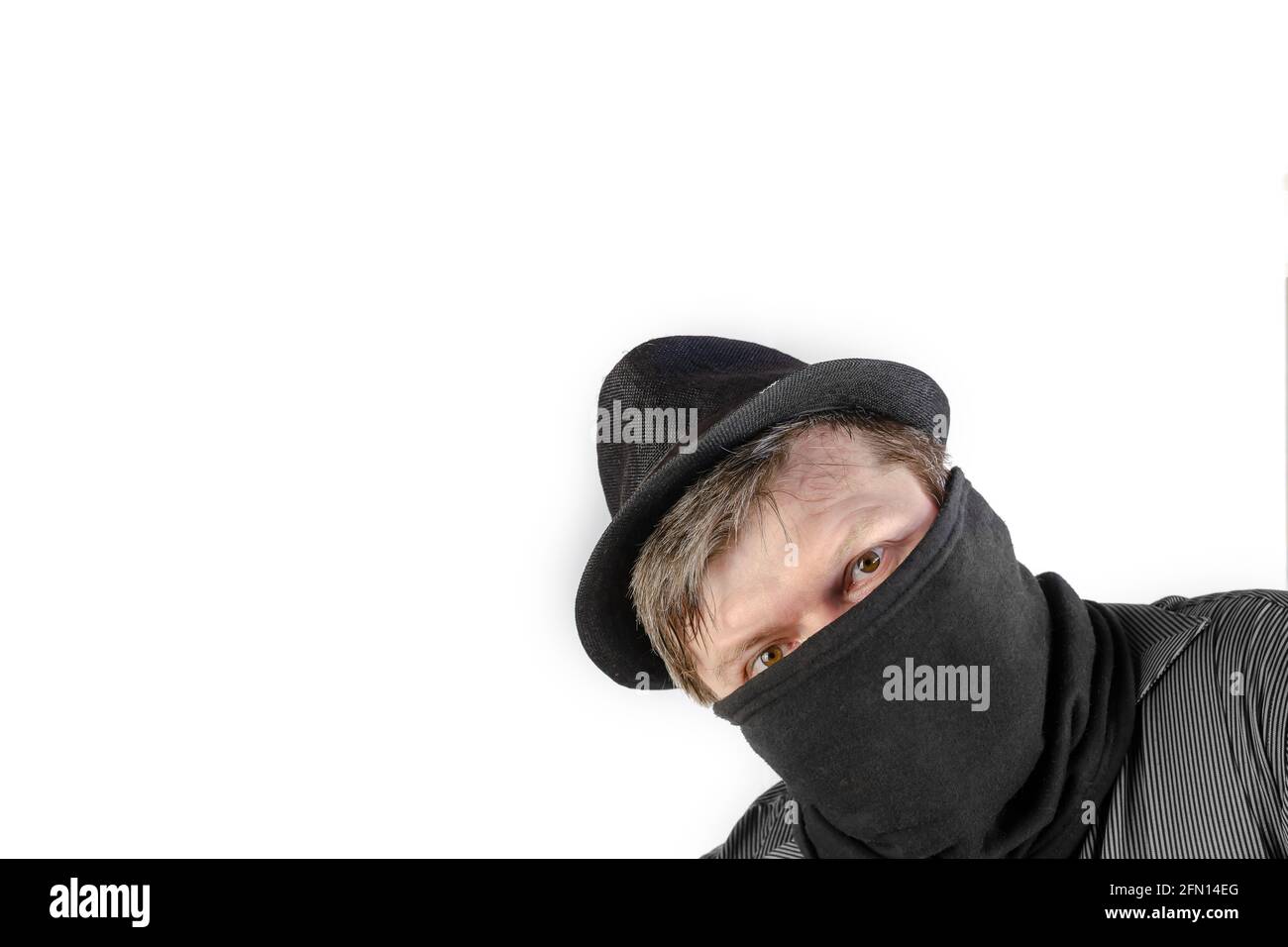 Middle-aged man wearing black hat with small brim and scarf over his ...