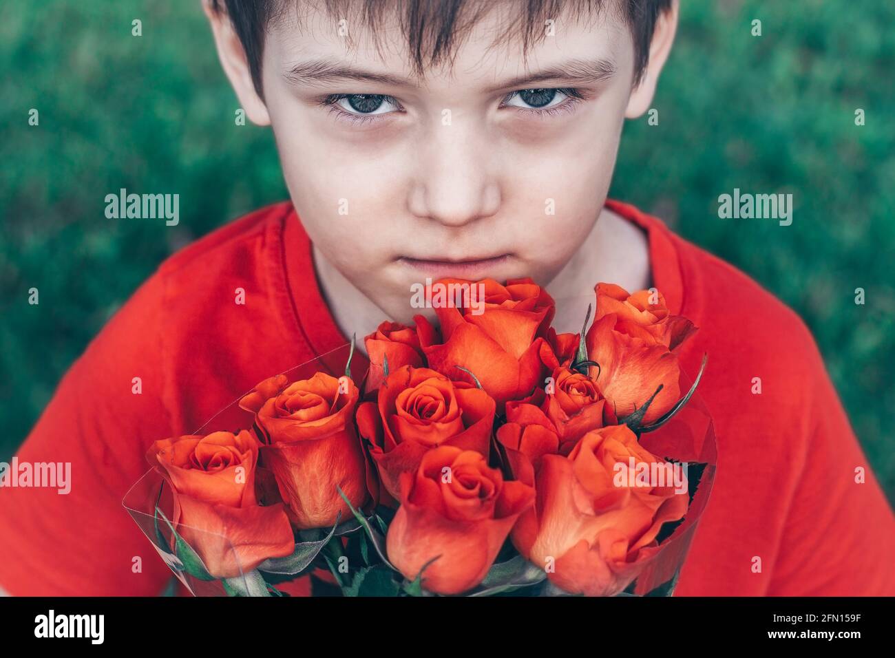 Boy with roses hi-res stock photography and images - Alamy