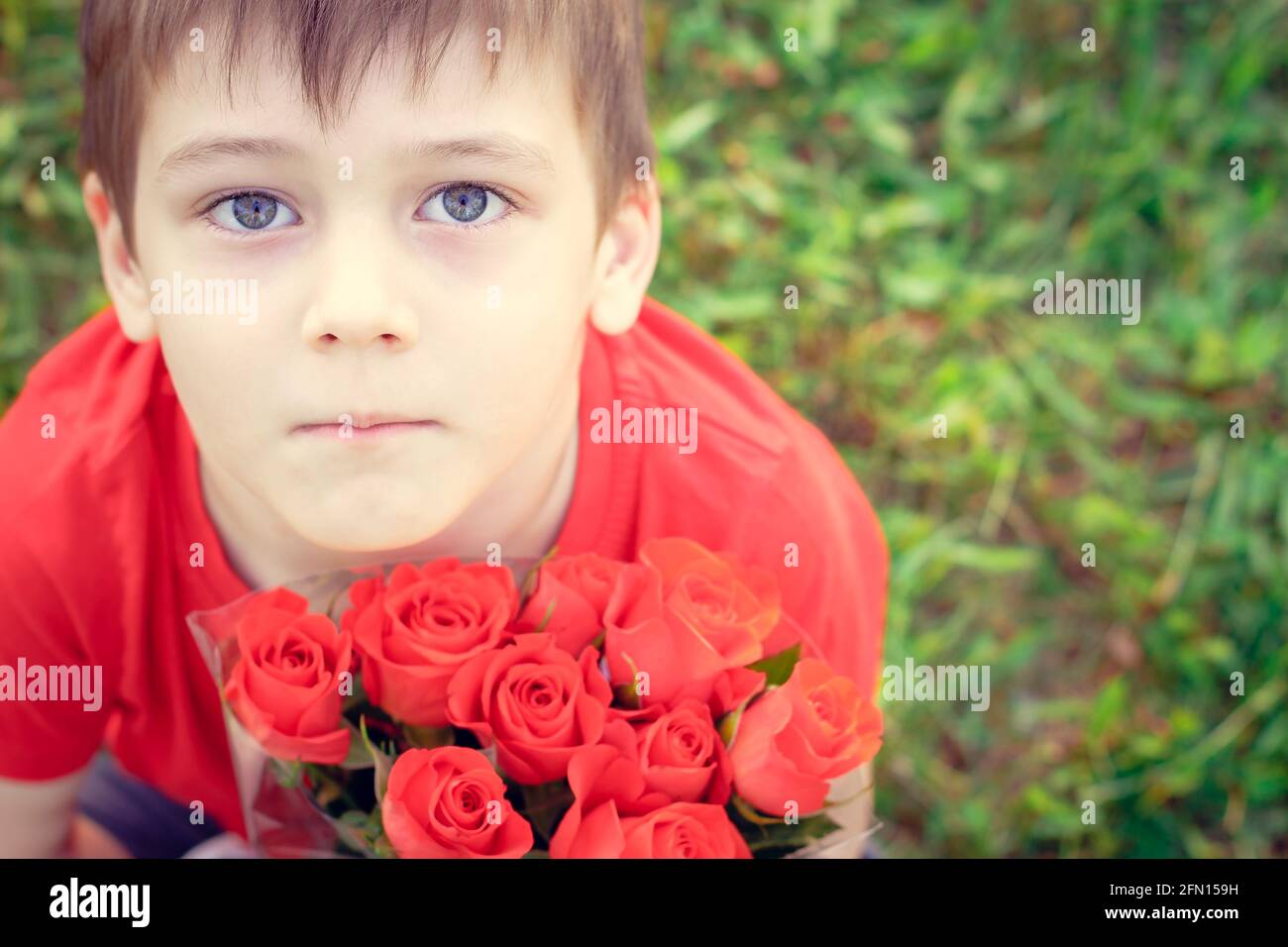 Boy with roses hi-res stock photography and images - Alamy