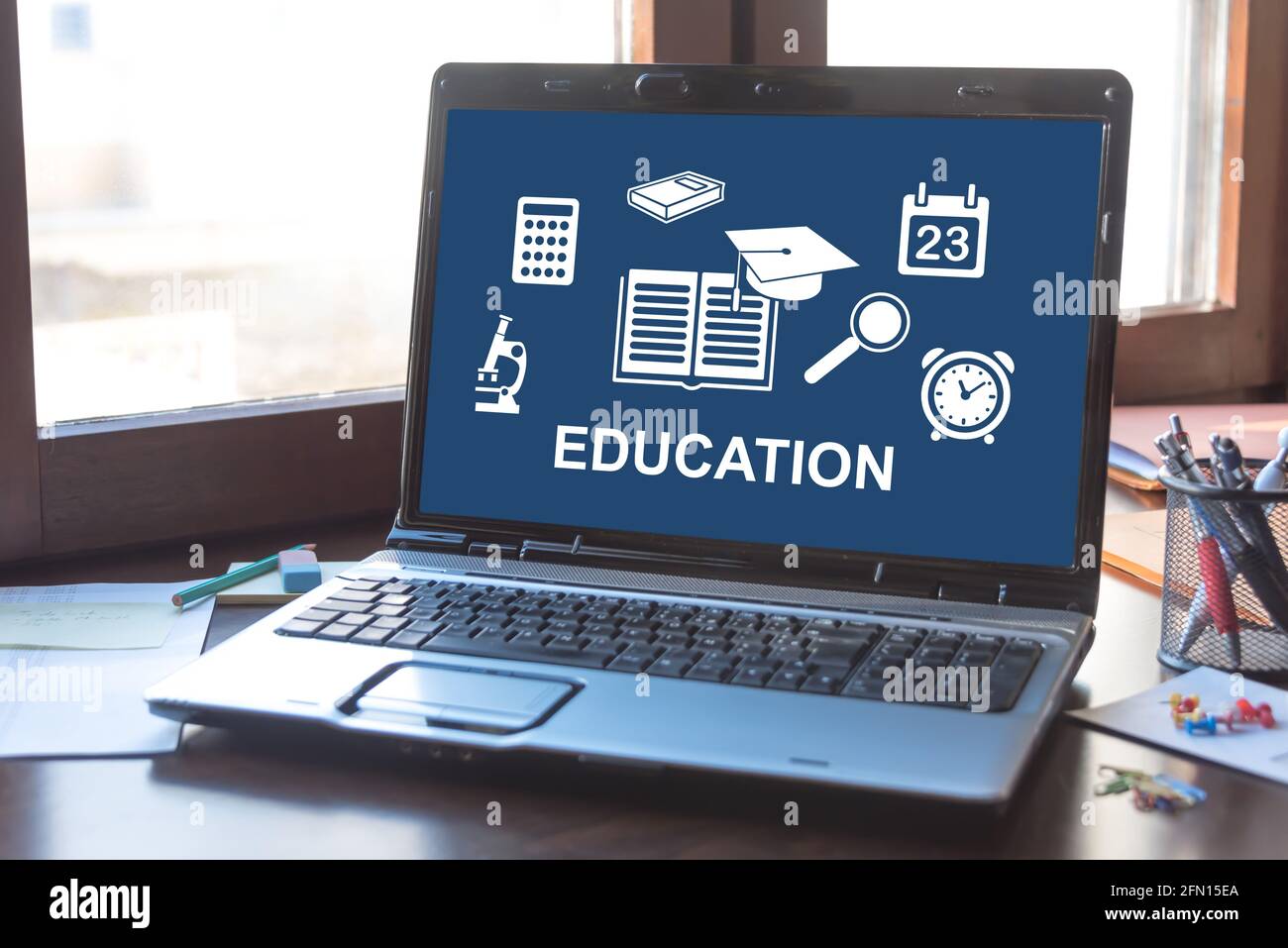 Laptop screen displaying an education concept Stock Photo - Alamy