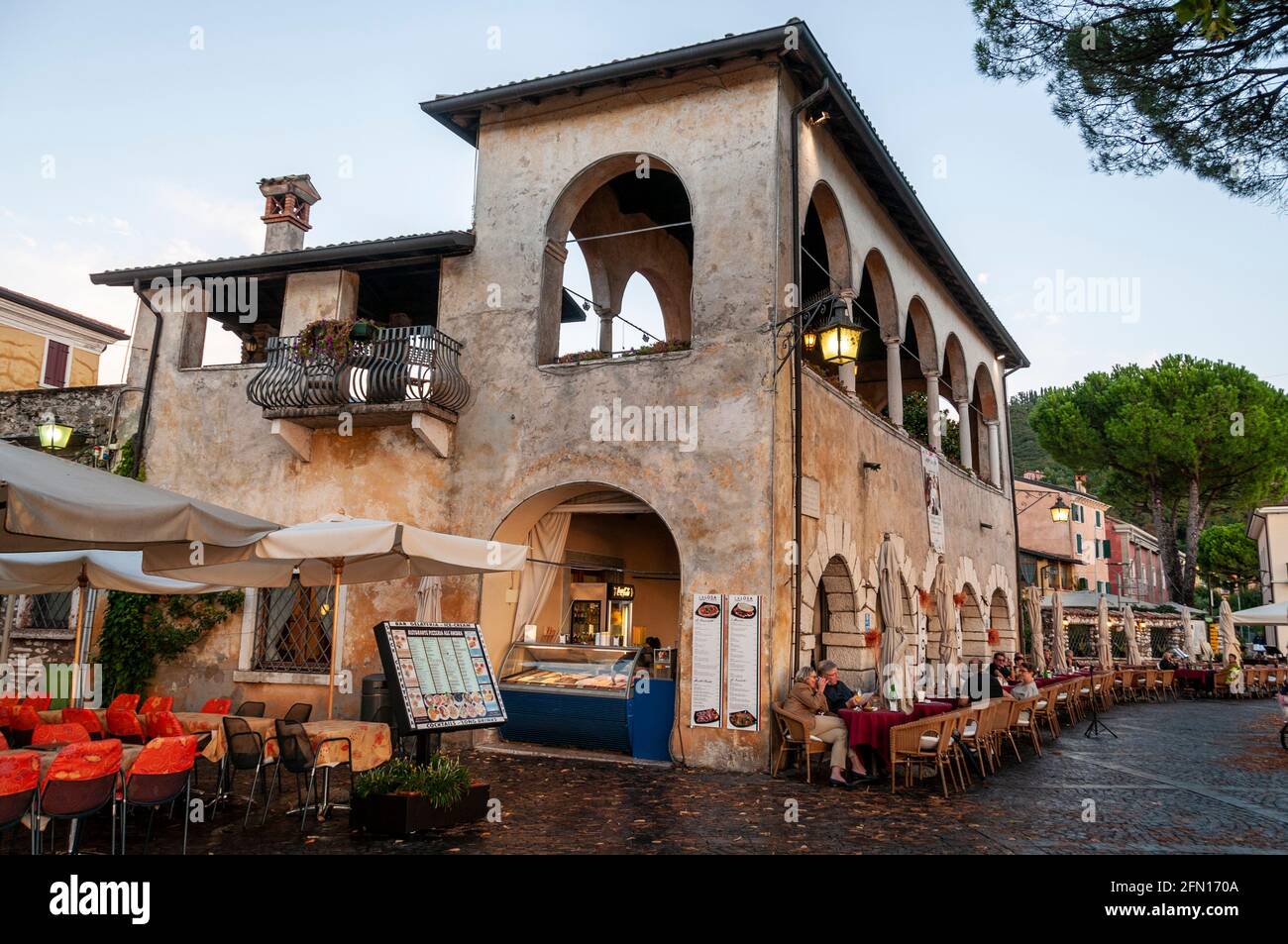 An old building converted into a restaurant with large arches on Lungo ...